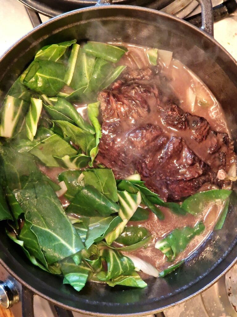 Beef shoulder braised in red wine with green chard and pearl onions ...